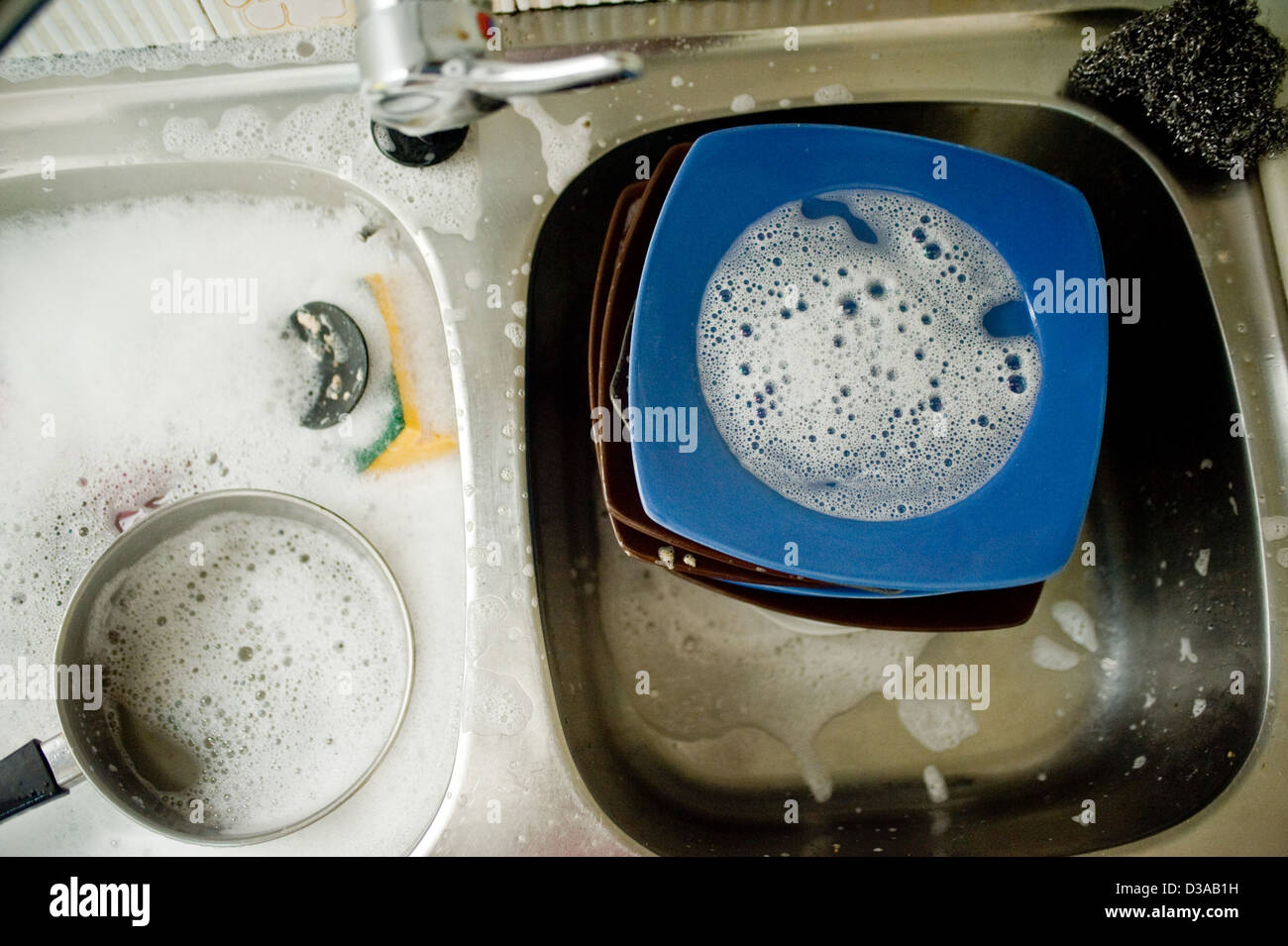 Dirty dishes in kitchen sink Stock Photo - Alamy