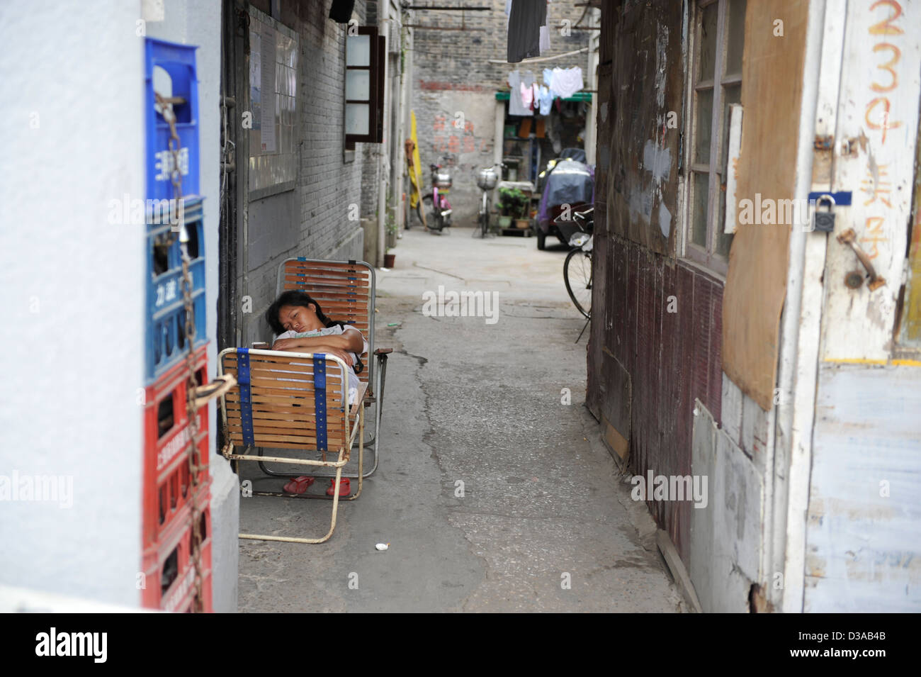 girl sleeping outside her home Stock Photo - Alamy