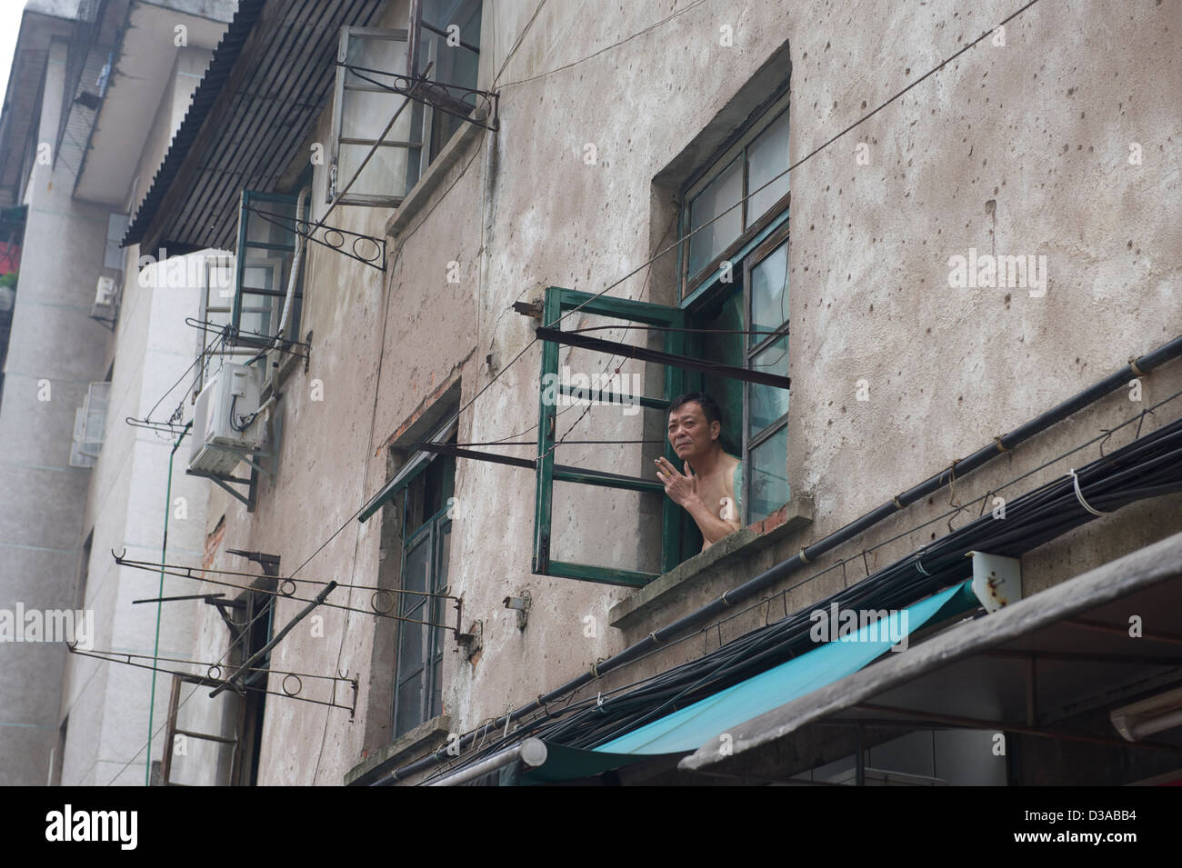 smoking on his window Stock Photo - Alamy