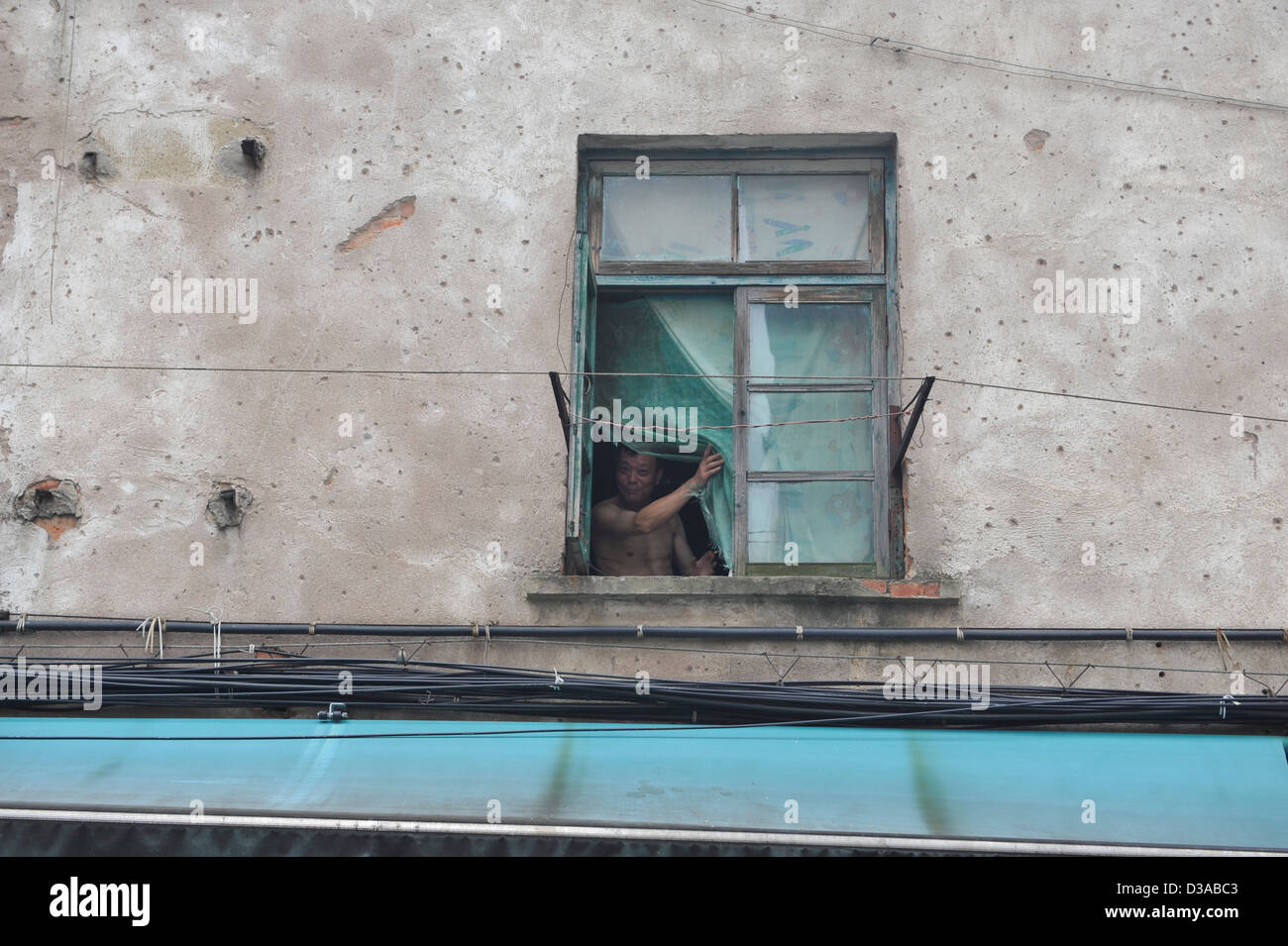 man taking a peak through his window Stock Photo - Alamy