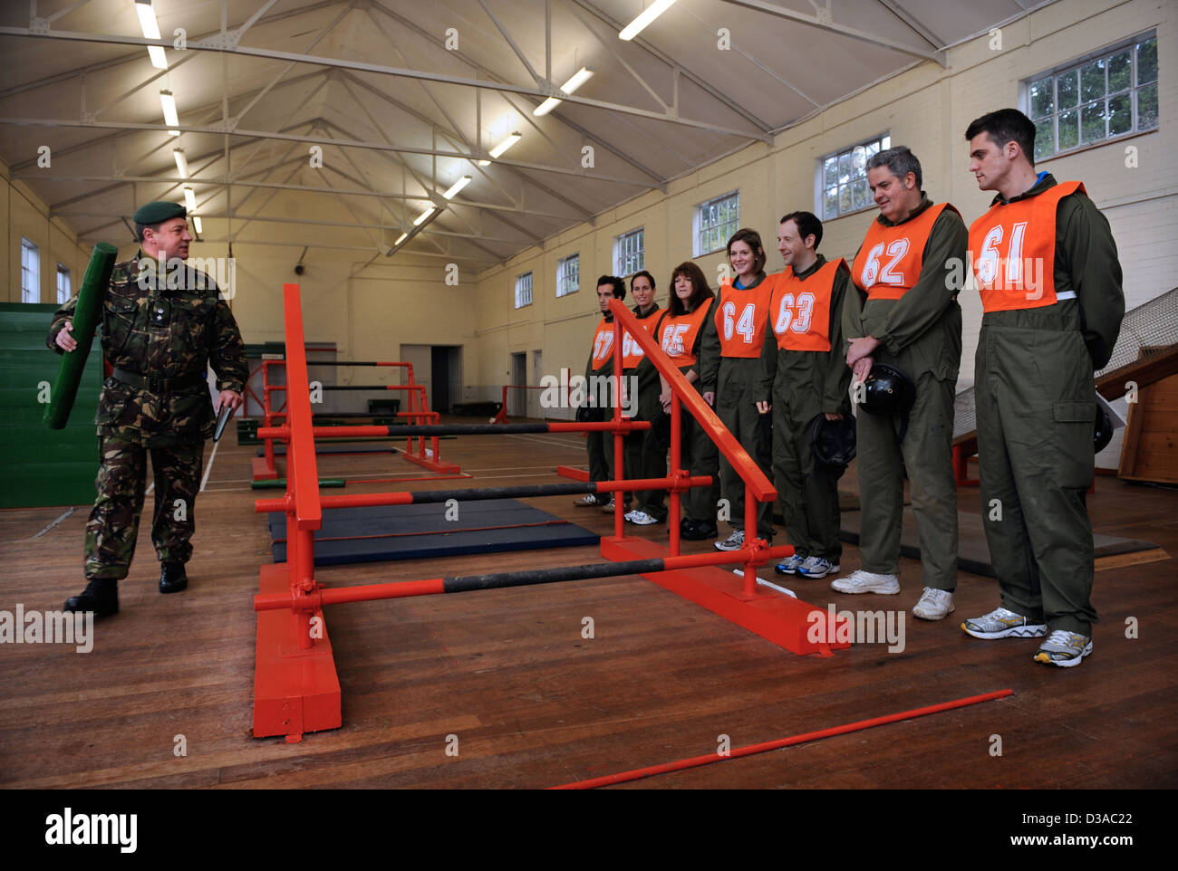 A recruiting officer details an assault course to older people ...