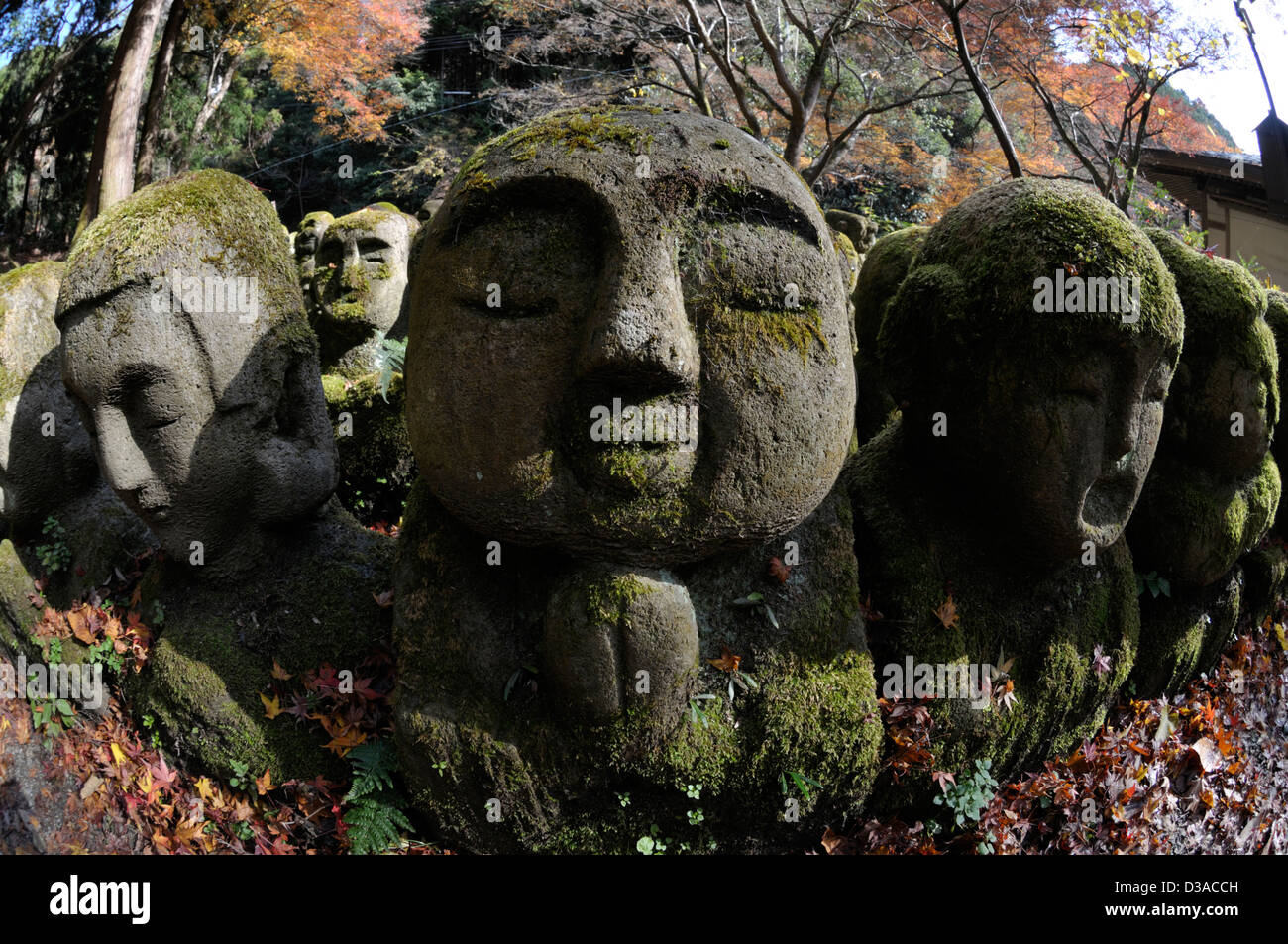 Groups of small religious statues in a temple garden Stock Photo - Alamy
