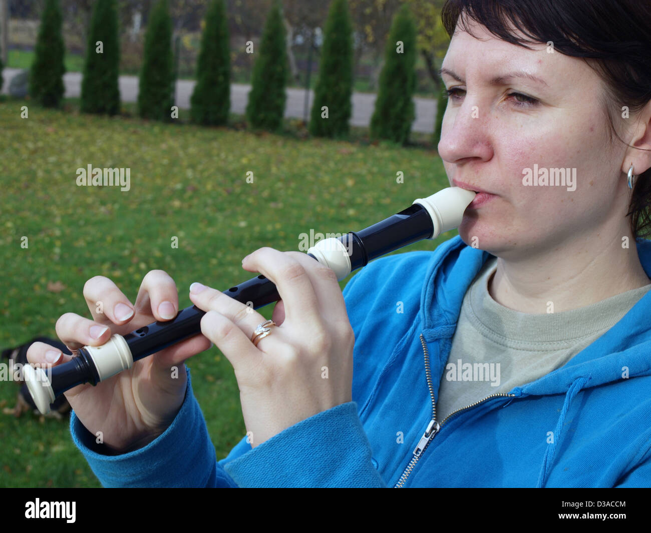 Young Woman Playing Flute High Resolution Stock Photography and Images ...