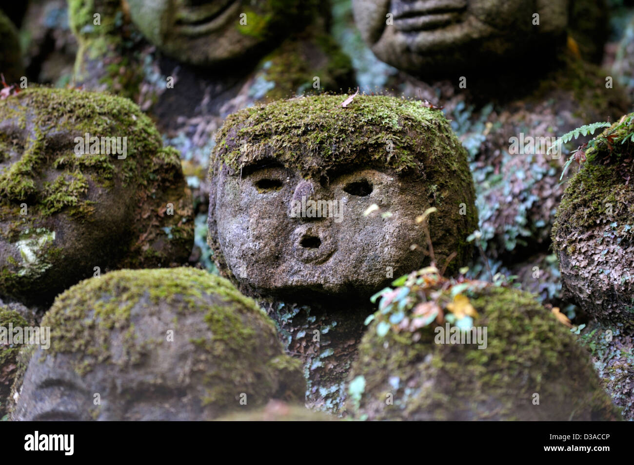 Groups of small religious statues in a temple garden Stock Photo - Alamy