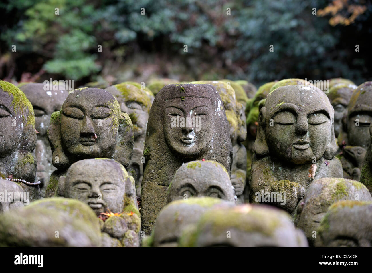 Groups of small religious statues in a temple garden Stock Photo - Alamy
