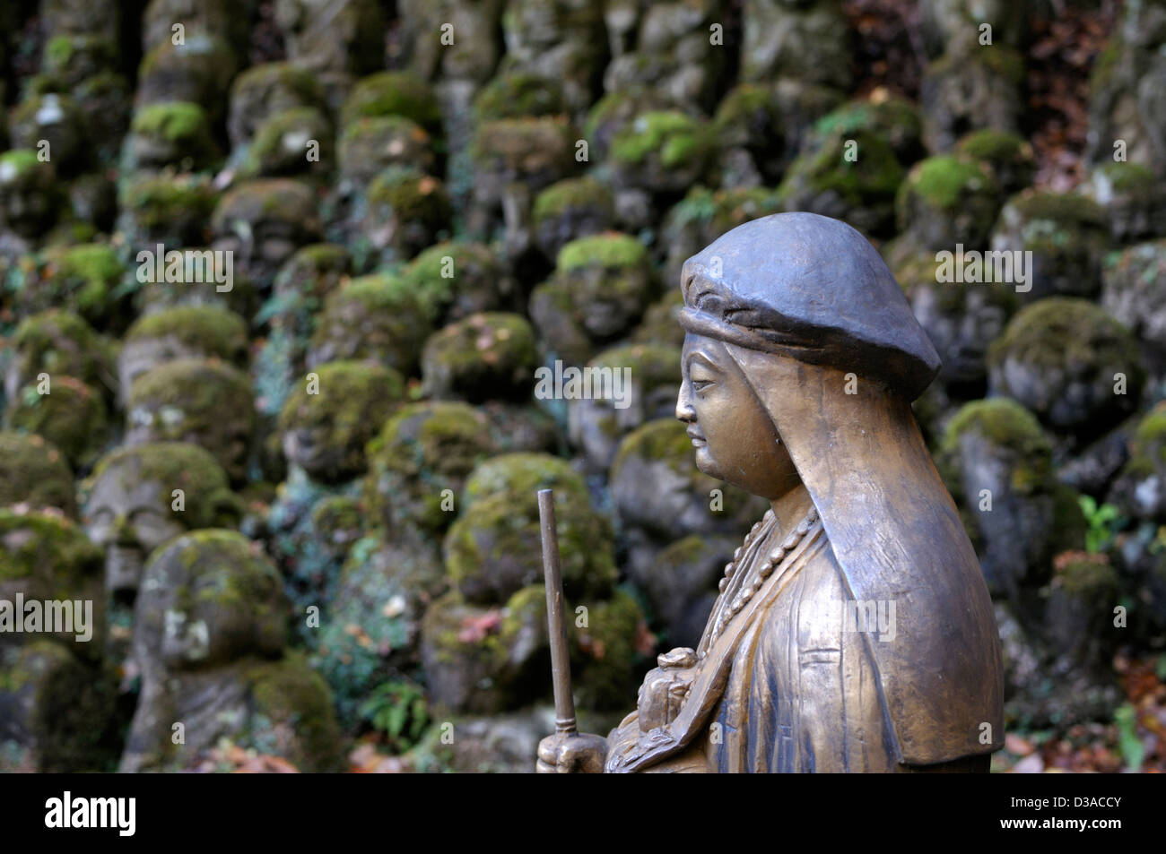 Groups of small religious statues in a temple garden Stock Photo - Alamy