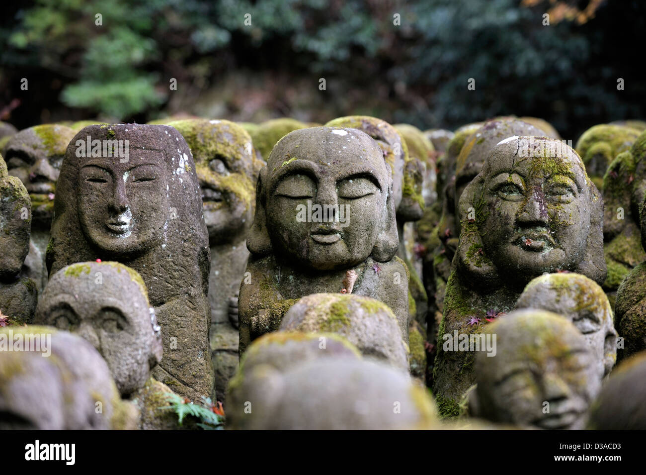 Groups of small religious statues in a temple garden Stock Photo - Alamy