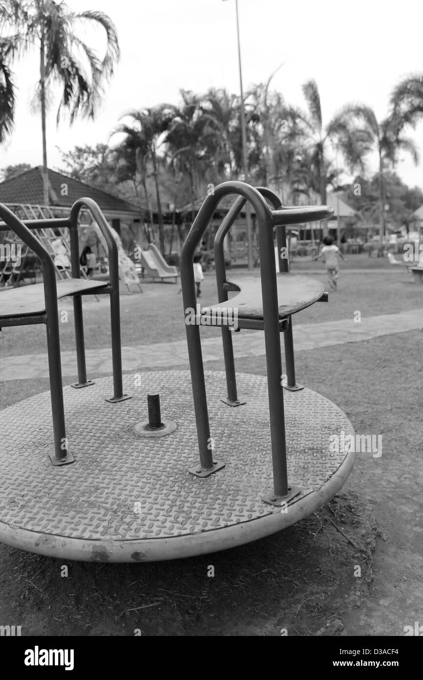 child play carousel in the playground Stock Photo - Alamy