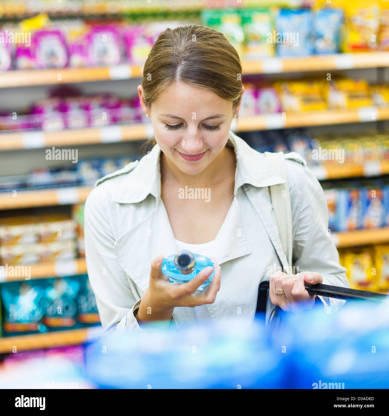 Beautiful young woman shopping in a grocery store/supermarket (color toned image Stock Photo - Alamy