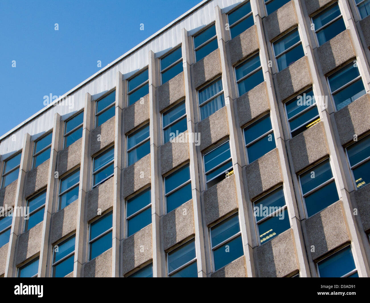 modern office building windows, blue sky, steep angle Stock Photo - Alamy
