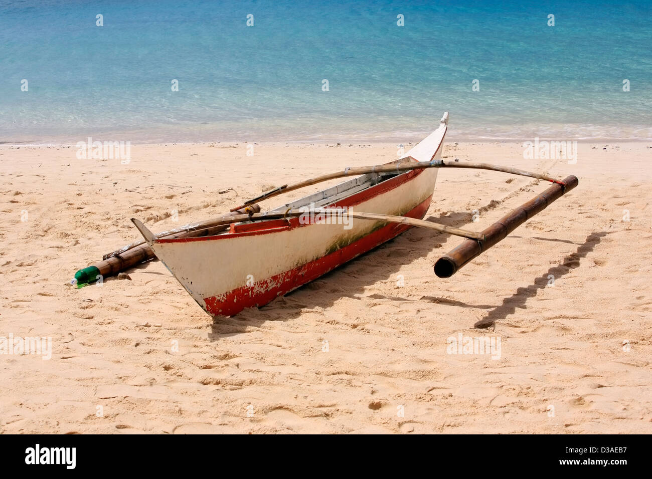 Lonely rowing boat on a coast of ocean Stock Photo - Alamy
