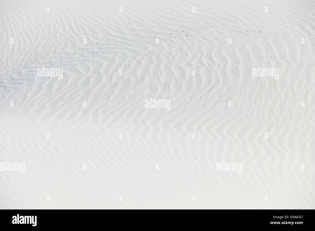 White quartz sand with wind waves on its surface Stock Photo - Alamy
