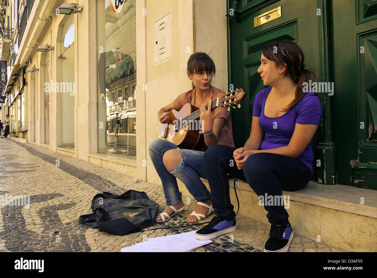 Kids busking in Lison Stock Photo - Alamy