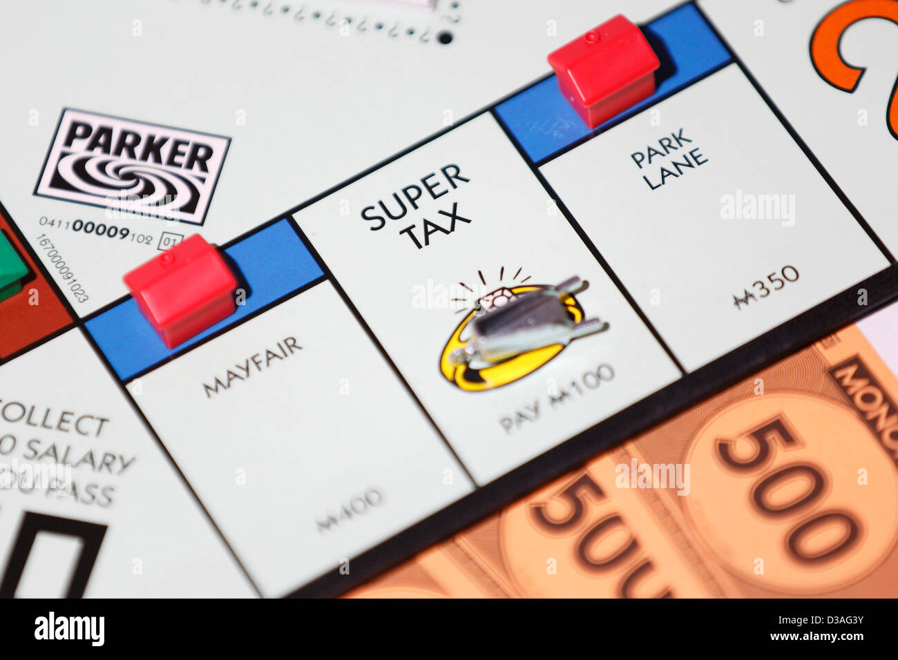 Super Tax on a Monopoly board game Stock Photo - Alamy