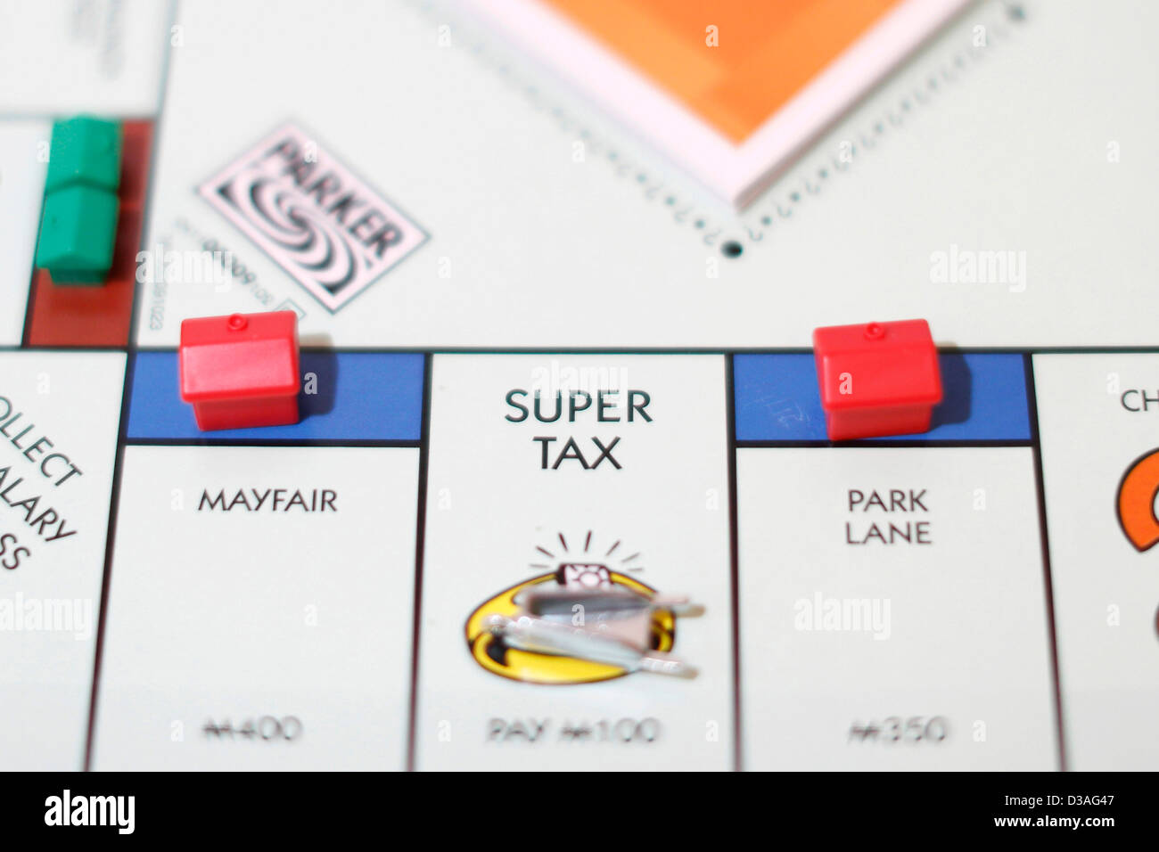 Suer Tax on a Monopoly board game Stock Photo - Alamy