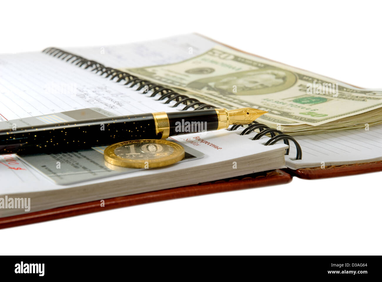 The pen, bank card, coin, dollars lays on weekly Stock Photo - Alamy