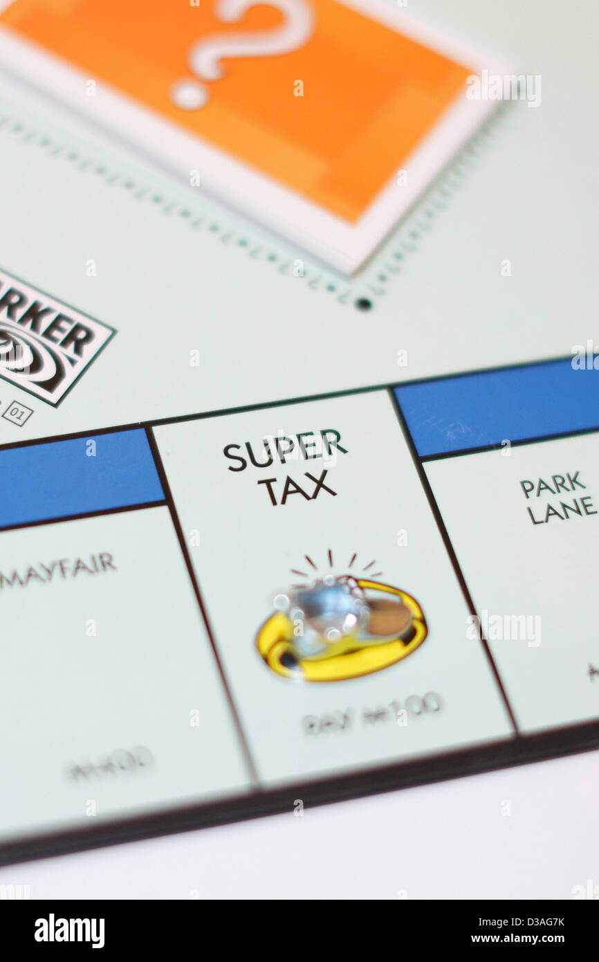 Super Tax on Monopoly board game Stock Photo - Alamy