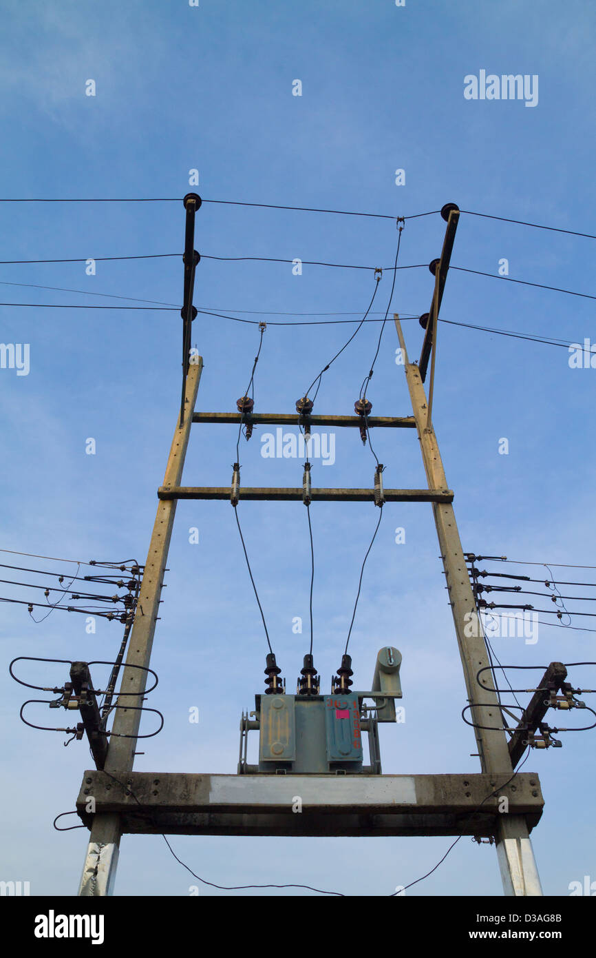 Electricity post with transformer on blue sky background Stock Photo ...