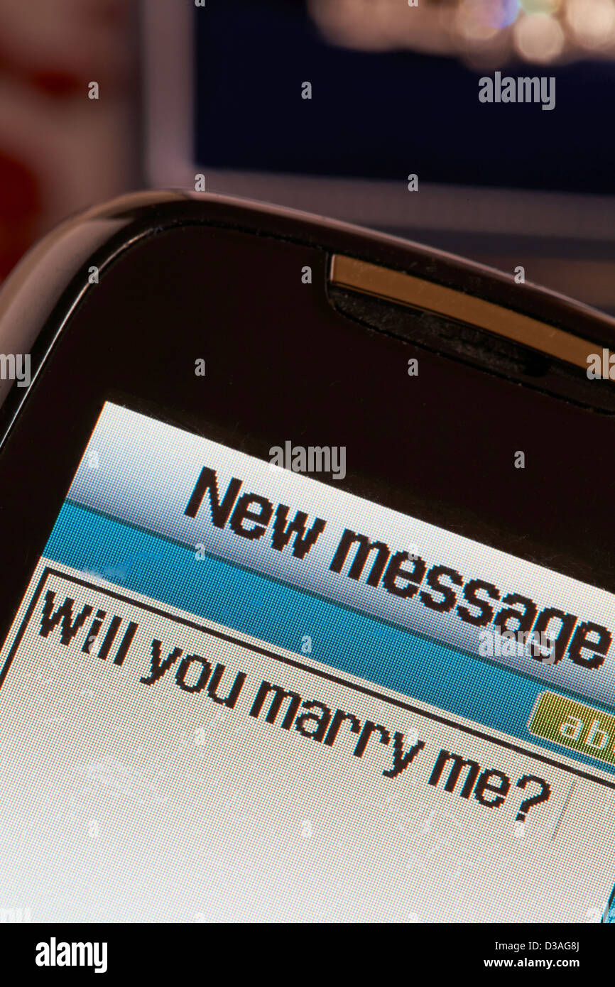Will you marry me? - sending text proposal with engagement ring at the ...