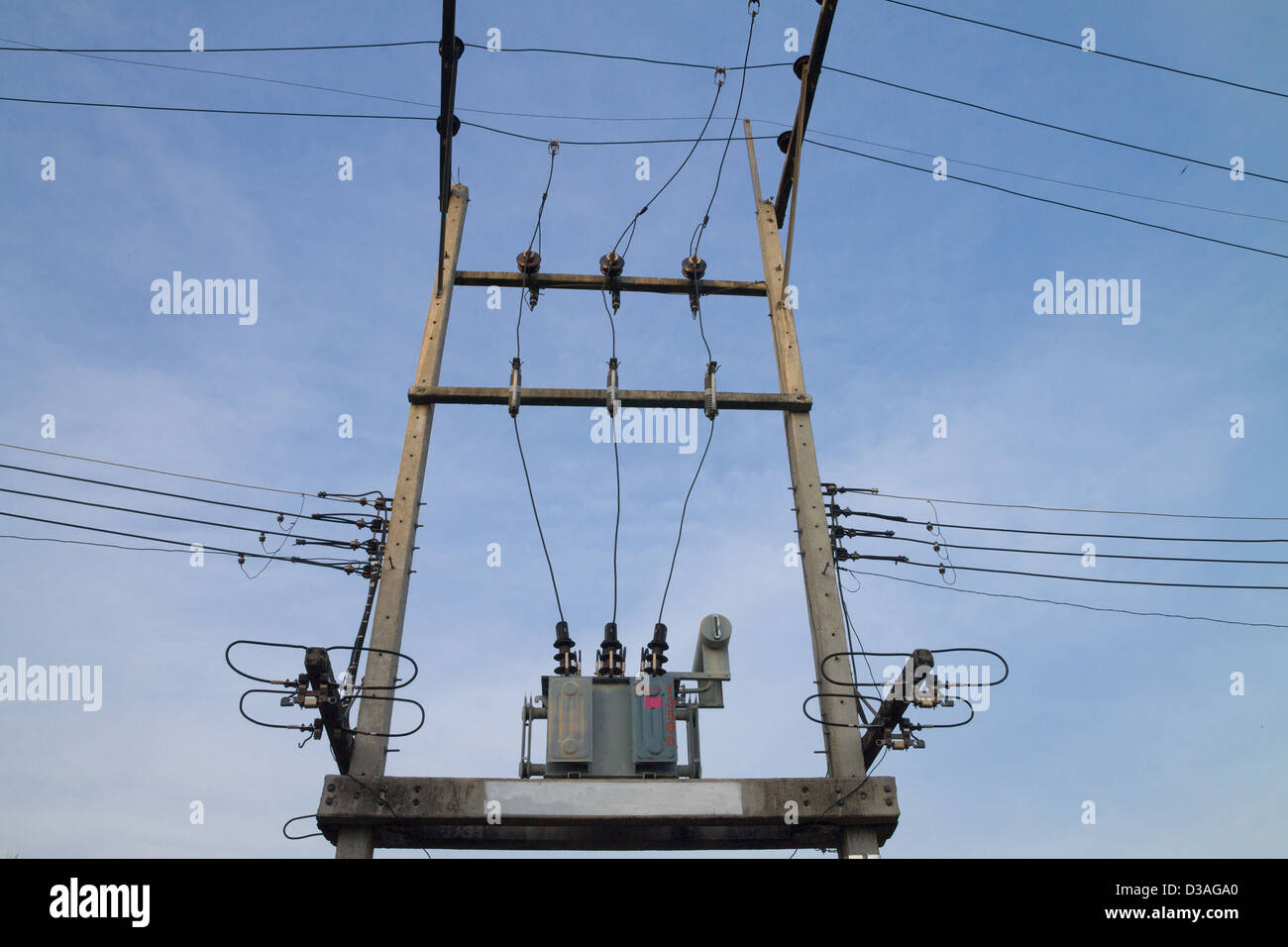 Electricity post with transformer on blue sky background Stock Photo ...