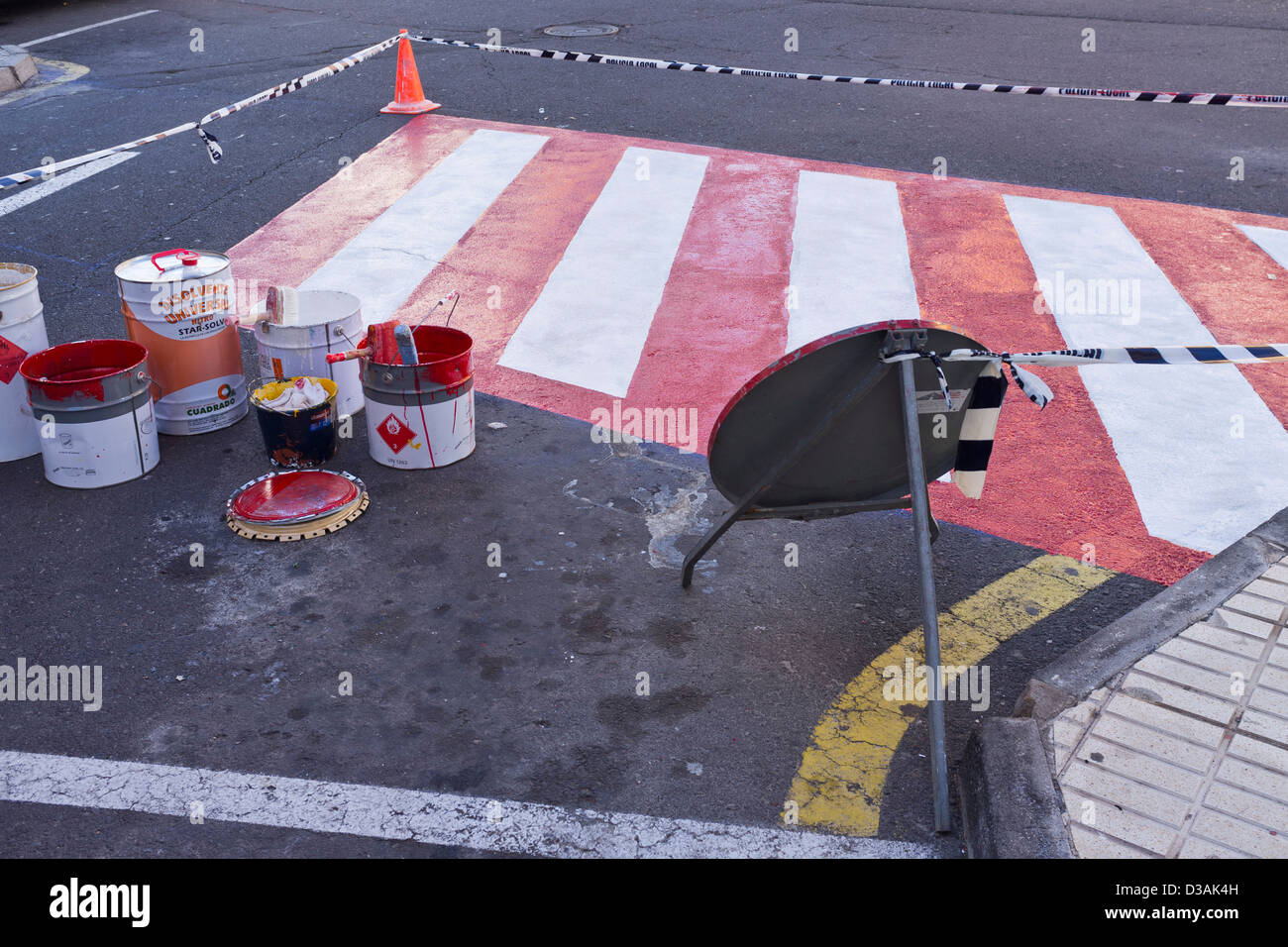 New pedestrian crossing points being painted in red and white Stock ...