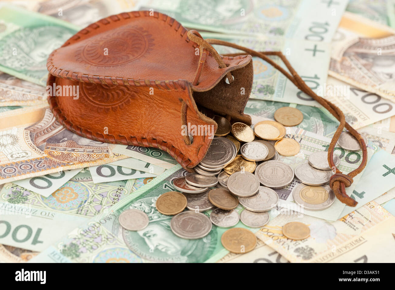 spilled coins with money-bag on banknote Stock Photo - Alamy