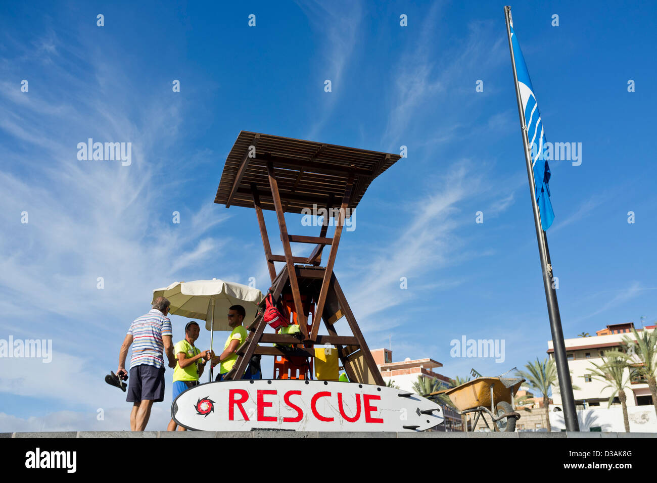 Lifeguard rescue station with wooden tower and surfboard marked rescue ...