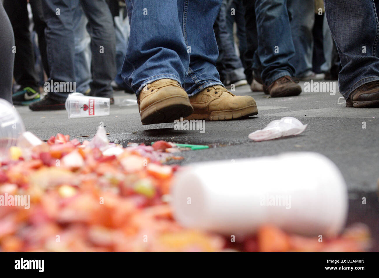 Berlin, Germany, discarded trash on the street with feet Stock Photo ...