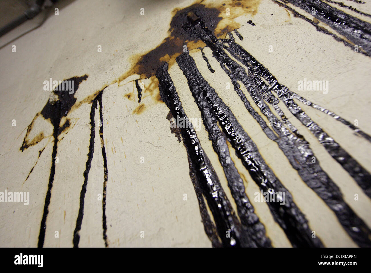 Berlin, Germany, from a wall escaping bitumen Stock Photo - Alamy