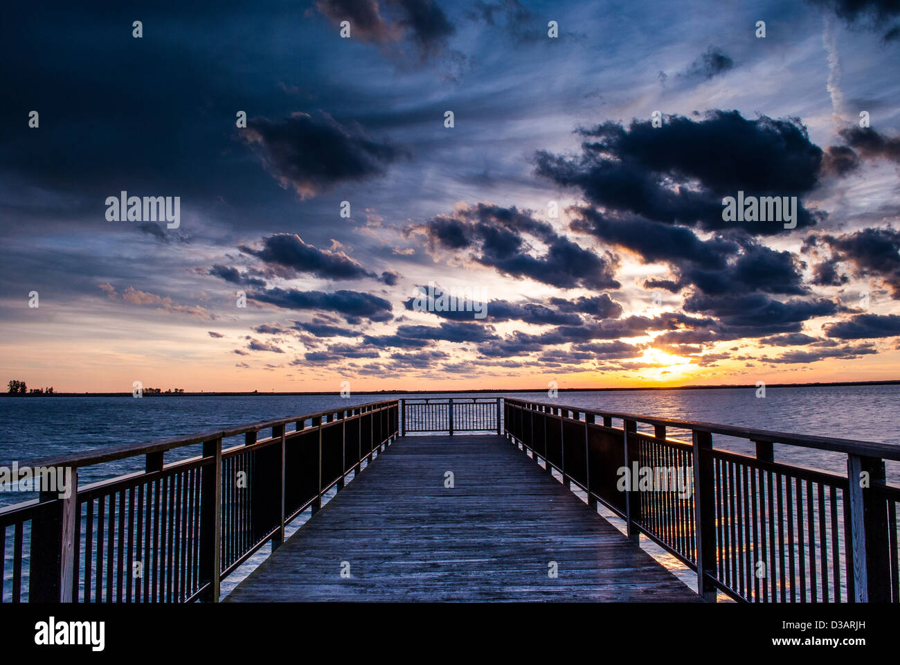 Photograph of a backlit pier near Buffalo New York taken at sunset with ...