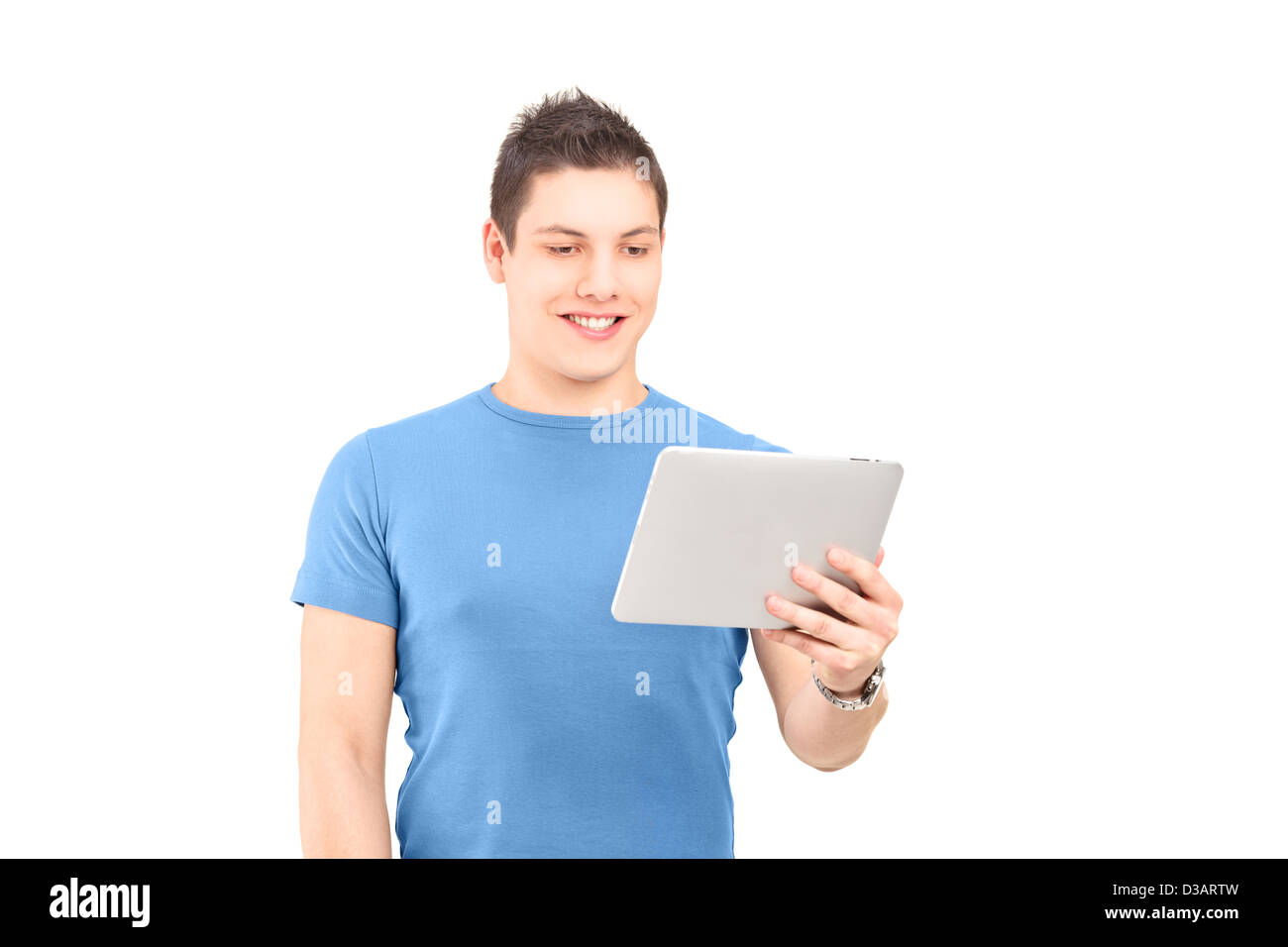 Young man standing and looking at tablet isolated on white background ...