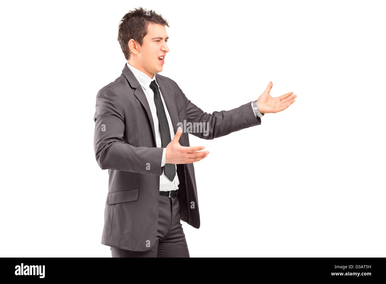 Young professional man in a suit arguing isolated on white background ...
