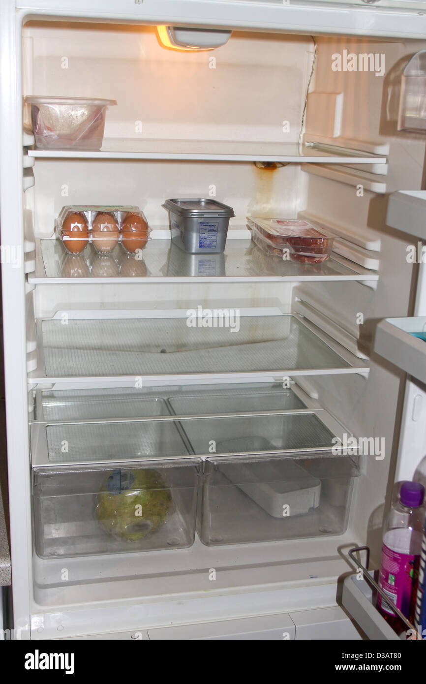 Sparse fridge interior with little food Stock Photo - Alamy