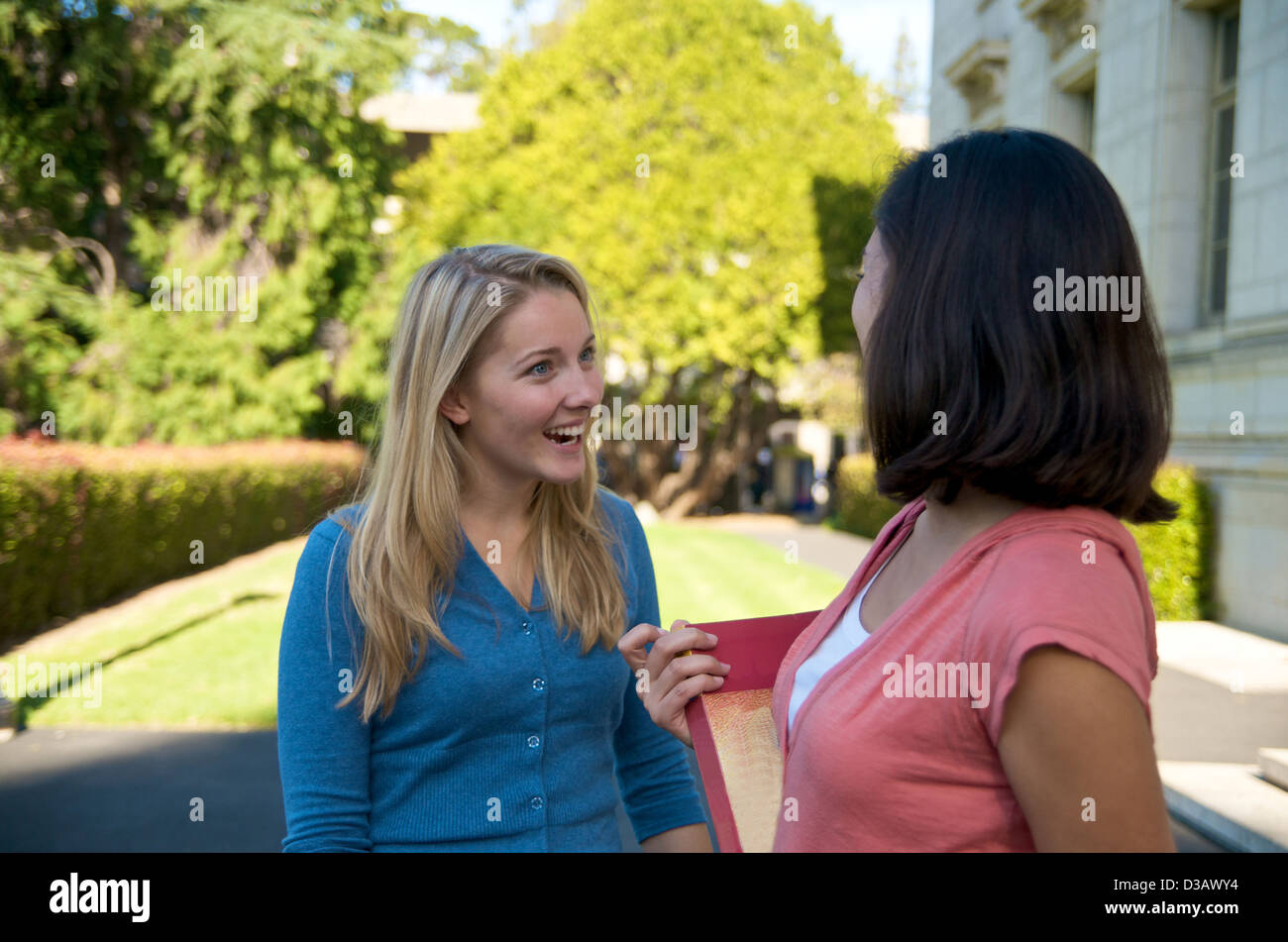 Student girls talking on University Campus Stock Photo - Alamy