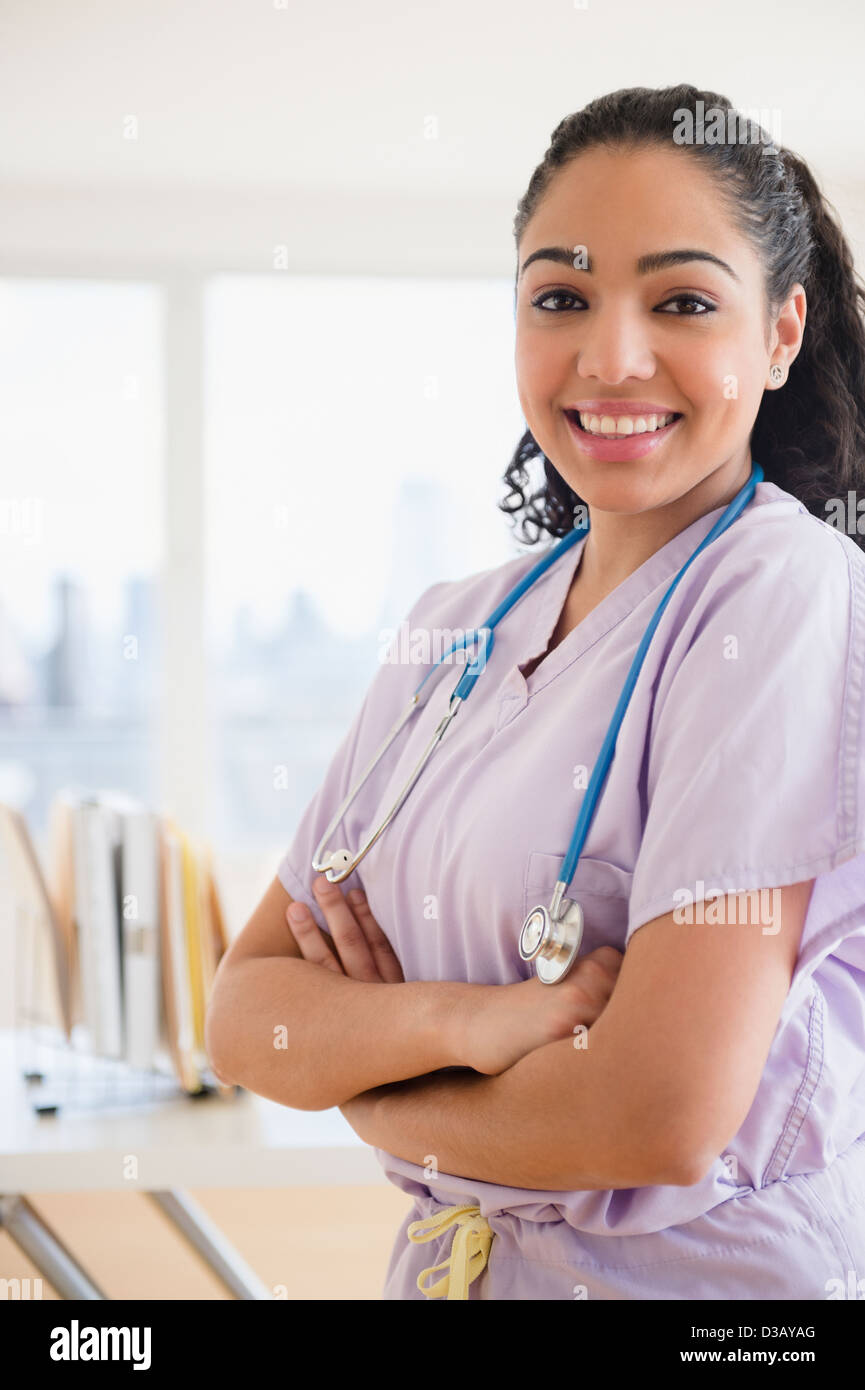 Hispanic nurse smiling in hospital Stock Photo - Alamy