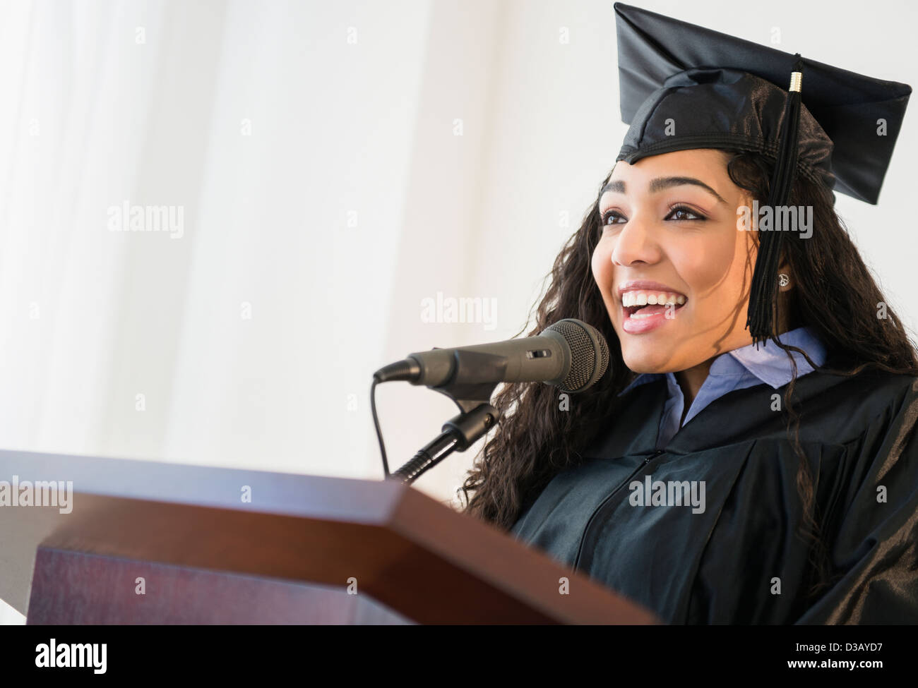 Hispanic student giving speech at graduation Stock Photo - Alamy