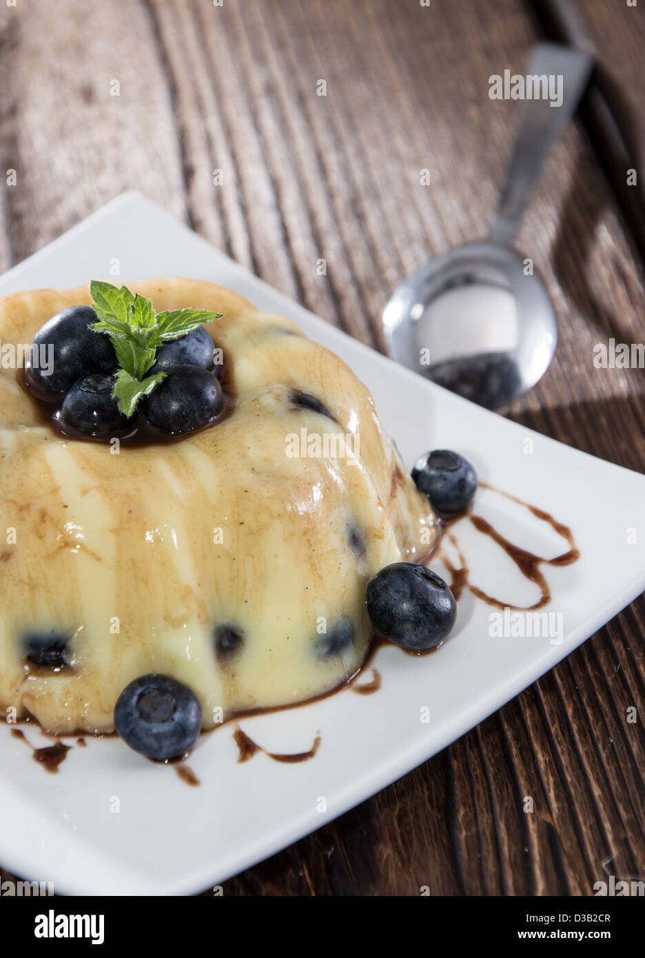 Fresh made Blueberry Pudding on wooden background Stock Photo - Alamy