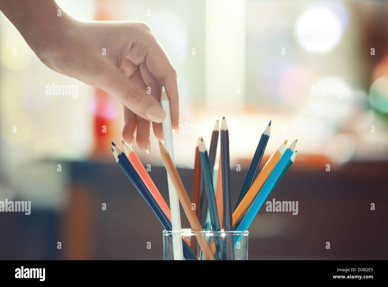 Human hand taking taking pencils Stock Photo - Alamy