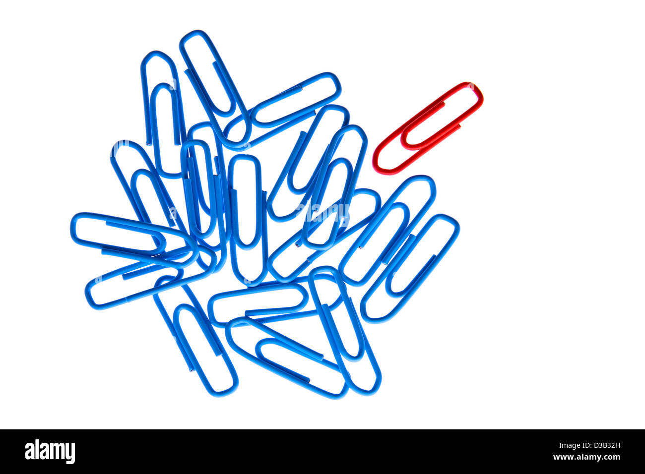 A lot of blue and one red small paperclips on a white background Stock ...