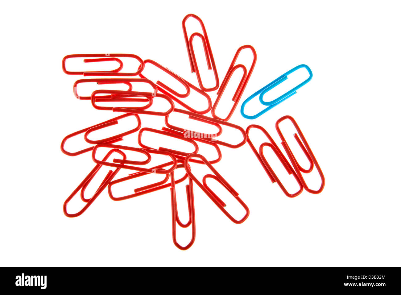 A lot of red and one blue small paperclips on a white background Stock ...