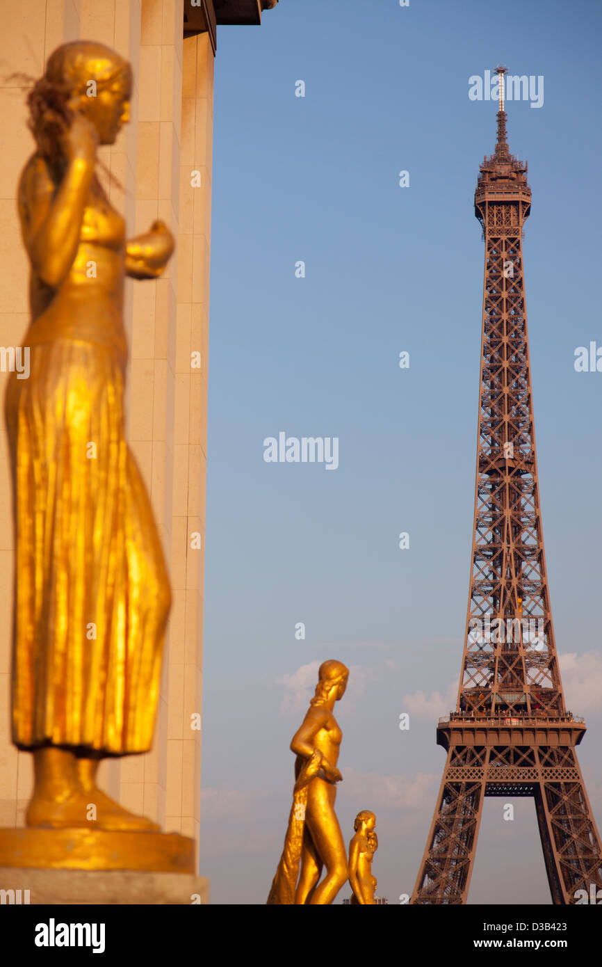 France, Paris, Eiffel tower with gold statues at the Palais De Chaillot ...