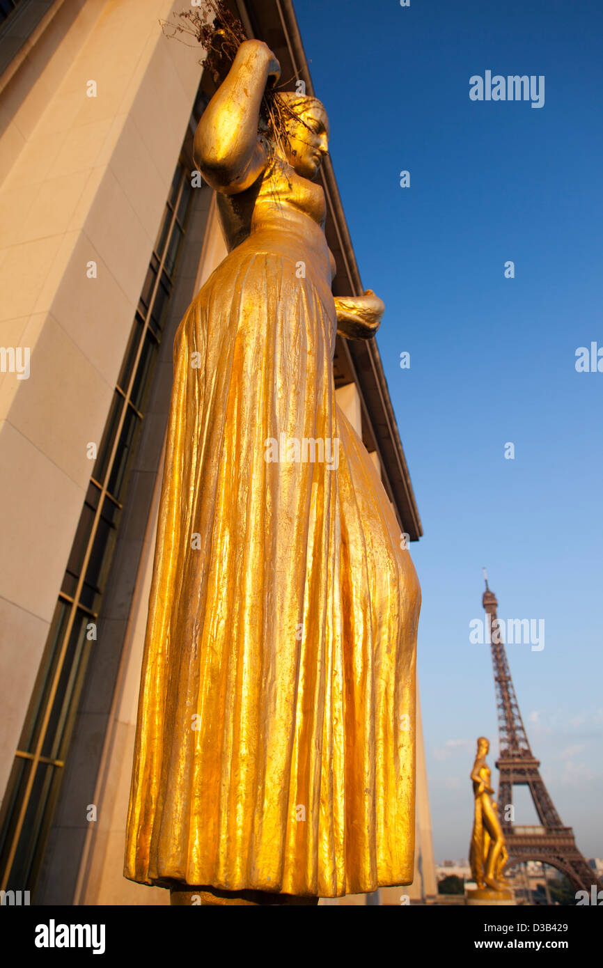 France, Paris, Eiffel tower with gold statues at the Palais De Chaillot ...