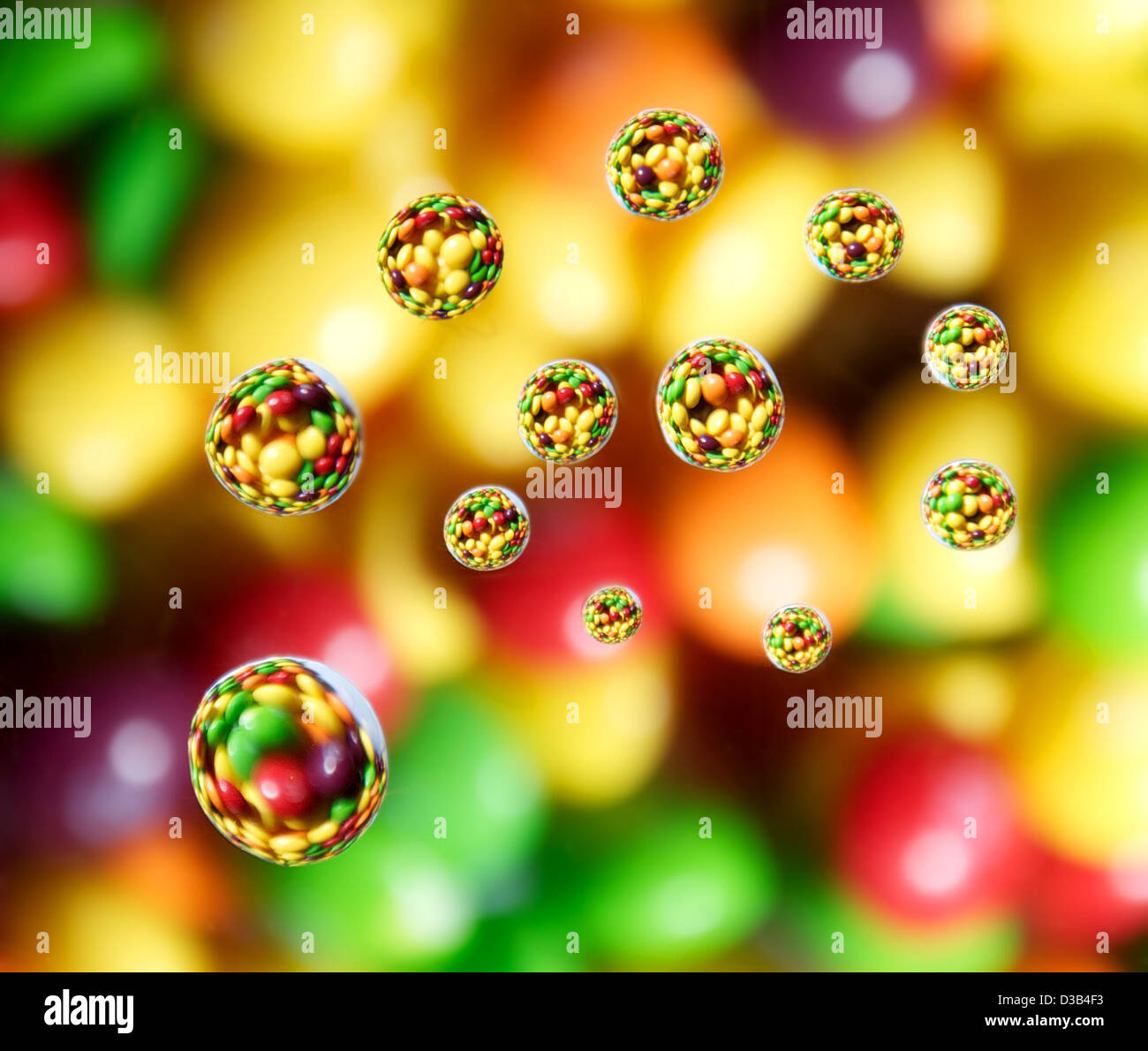 Bright coloured water drops with sweets Stock Photo - Alamy