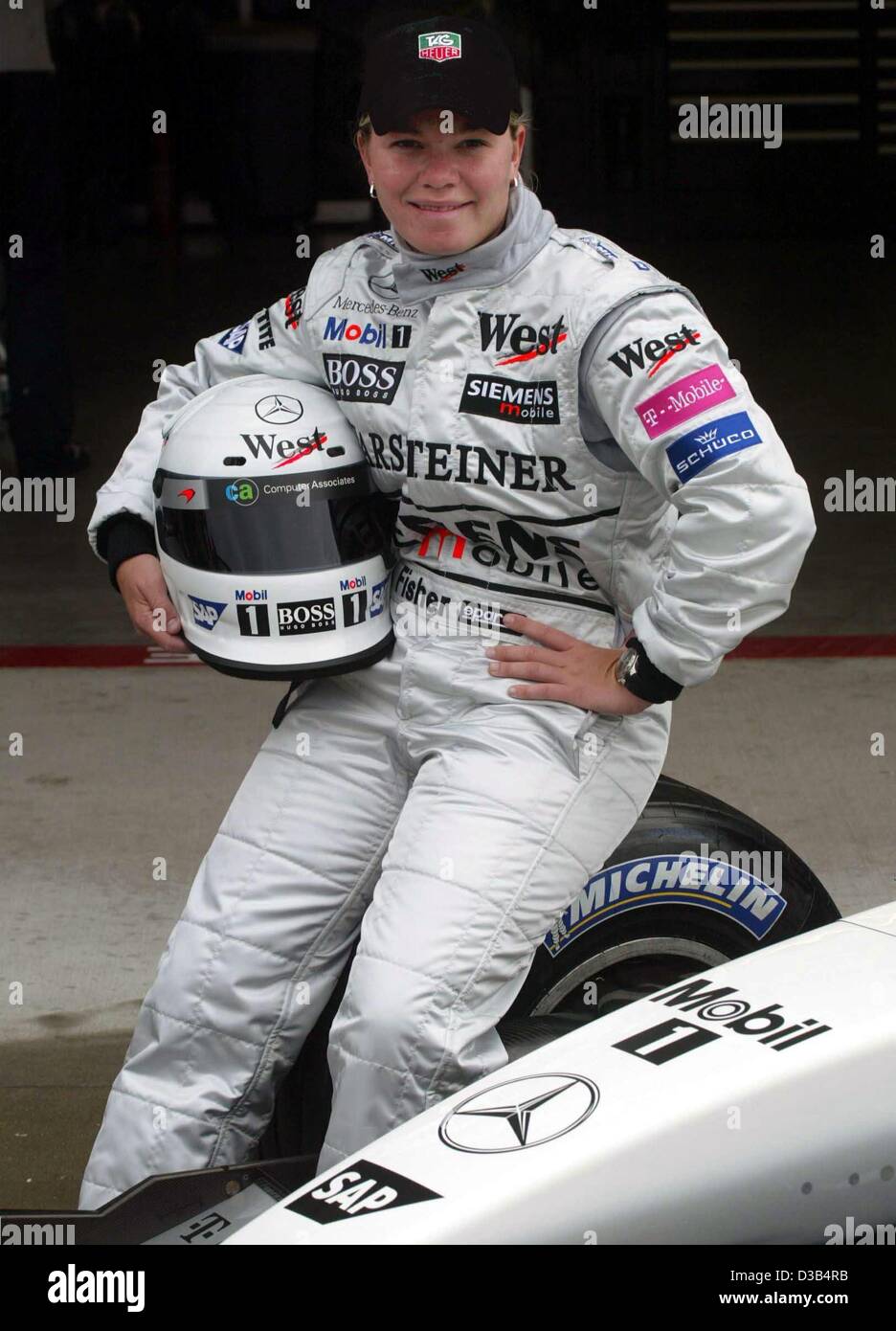 (dpa) - US race driver Sarah Fisher poses on a McLaren Mercedes ...