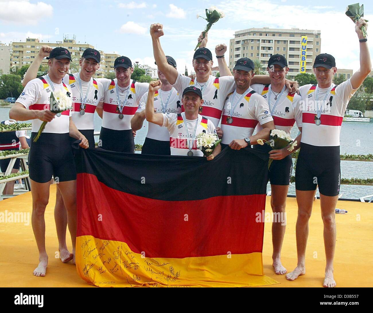 (dpa) - The rowers of the German Men Eight pose with their silver ...