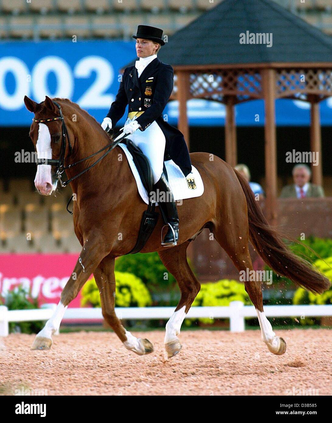 (dpa) - German rider Nadine Capellmann rides her horse 'Farbenfroh ...