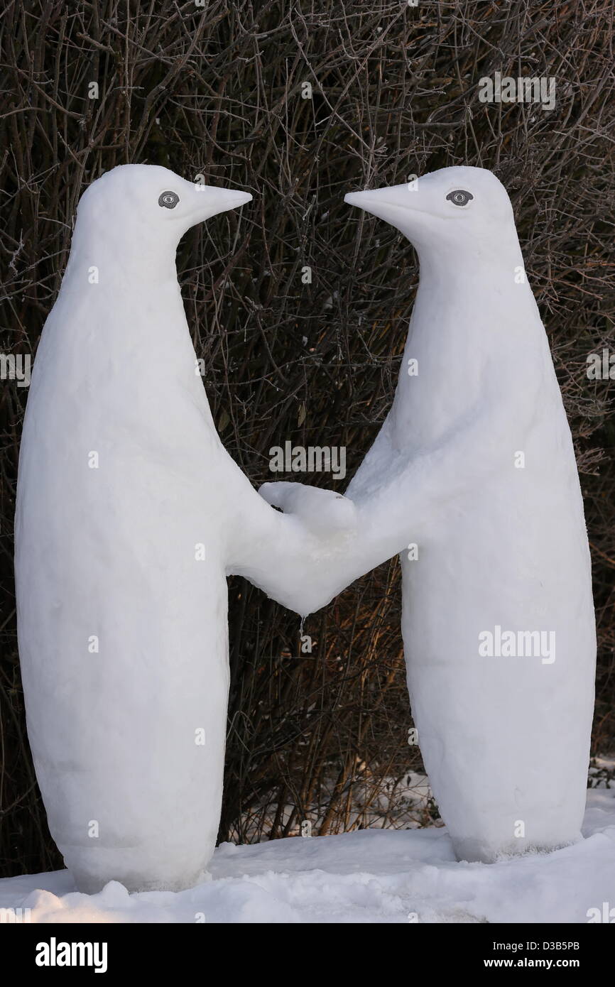 Two penguin sculptures made of snow stand near Hohenschaeftlarn ...