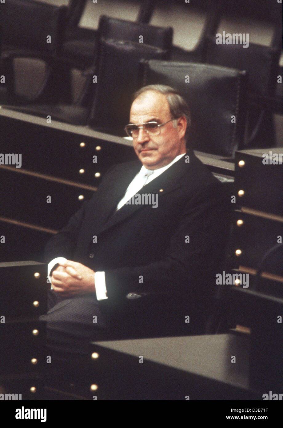 (dpa files) - Newly elected chancellor Helmut Kohl sits alone on the ...