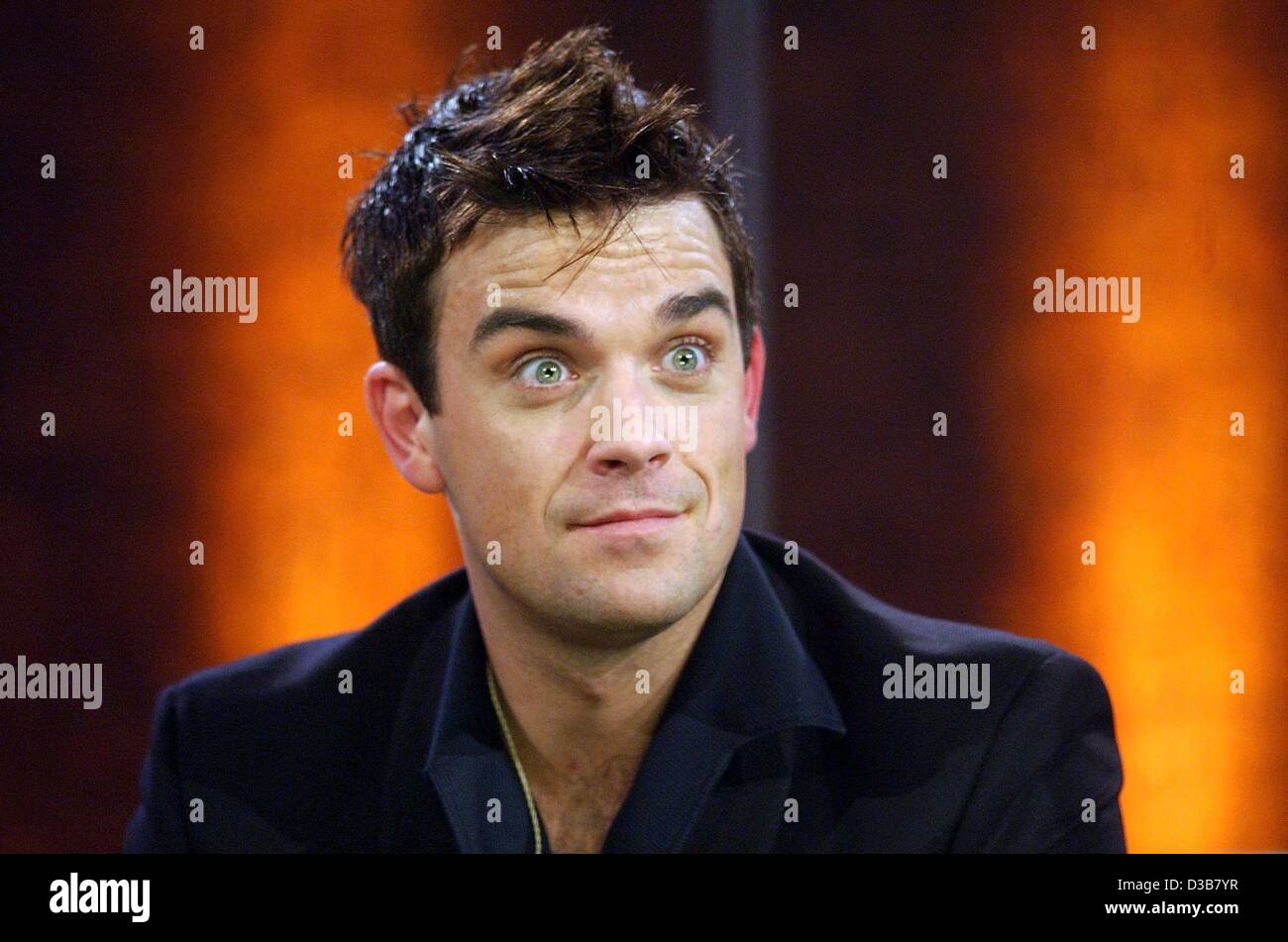 (dpa) - Surprised and with eyes wide open British pop star Robbie ...