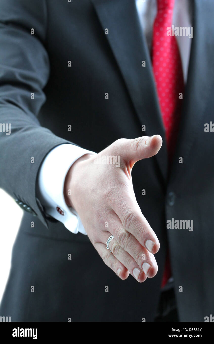 Young handsome businessman giving handshake hi-res stock photography ...